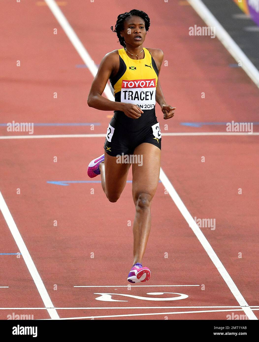 Jamaica's Ristananna Tracey crosses the finish line as she wins her ...
