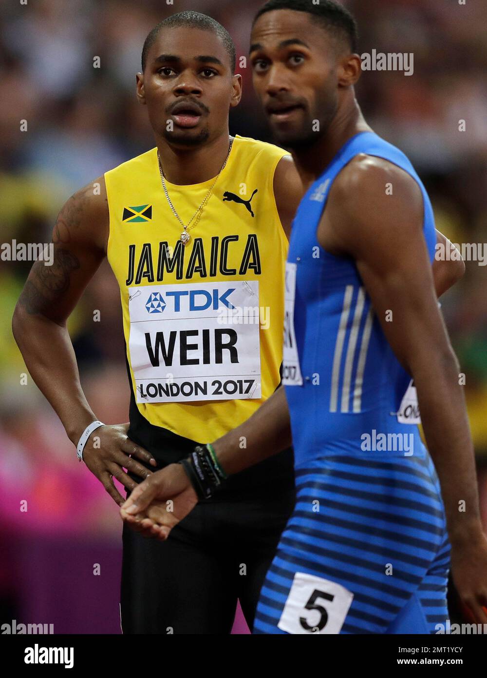 Jamaica's Warren Weir stands next to Western Samoa's Jeremy Dodson ...