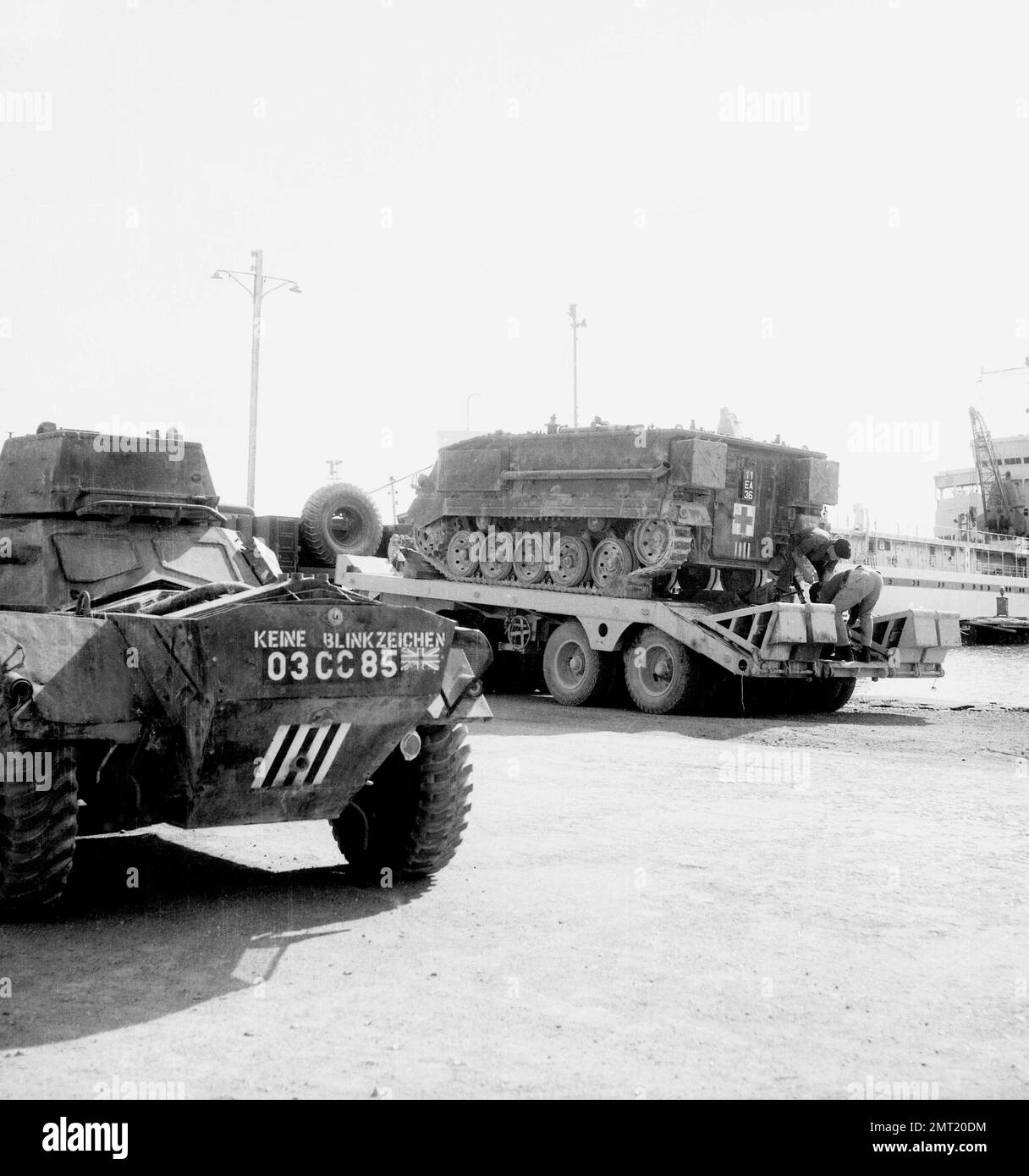 An armored car, left, and an armored personnel carrier from the British ...