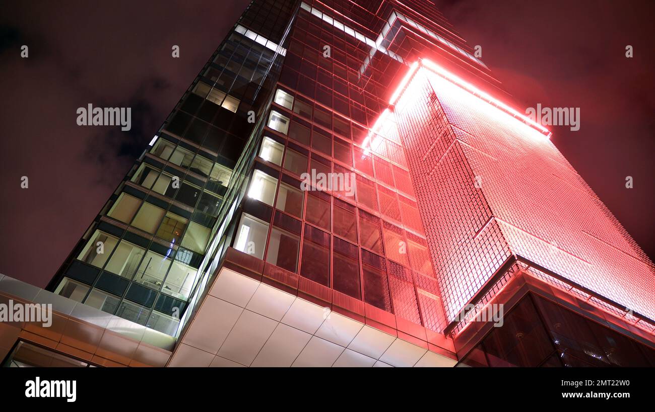Corporate building at night - business concept. Glass wall office ...