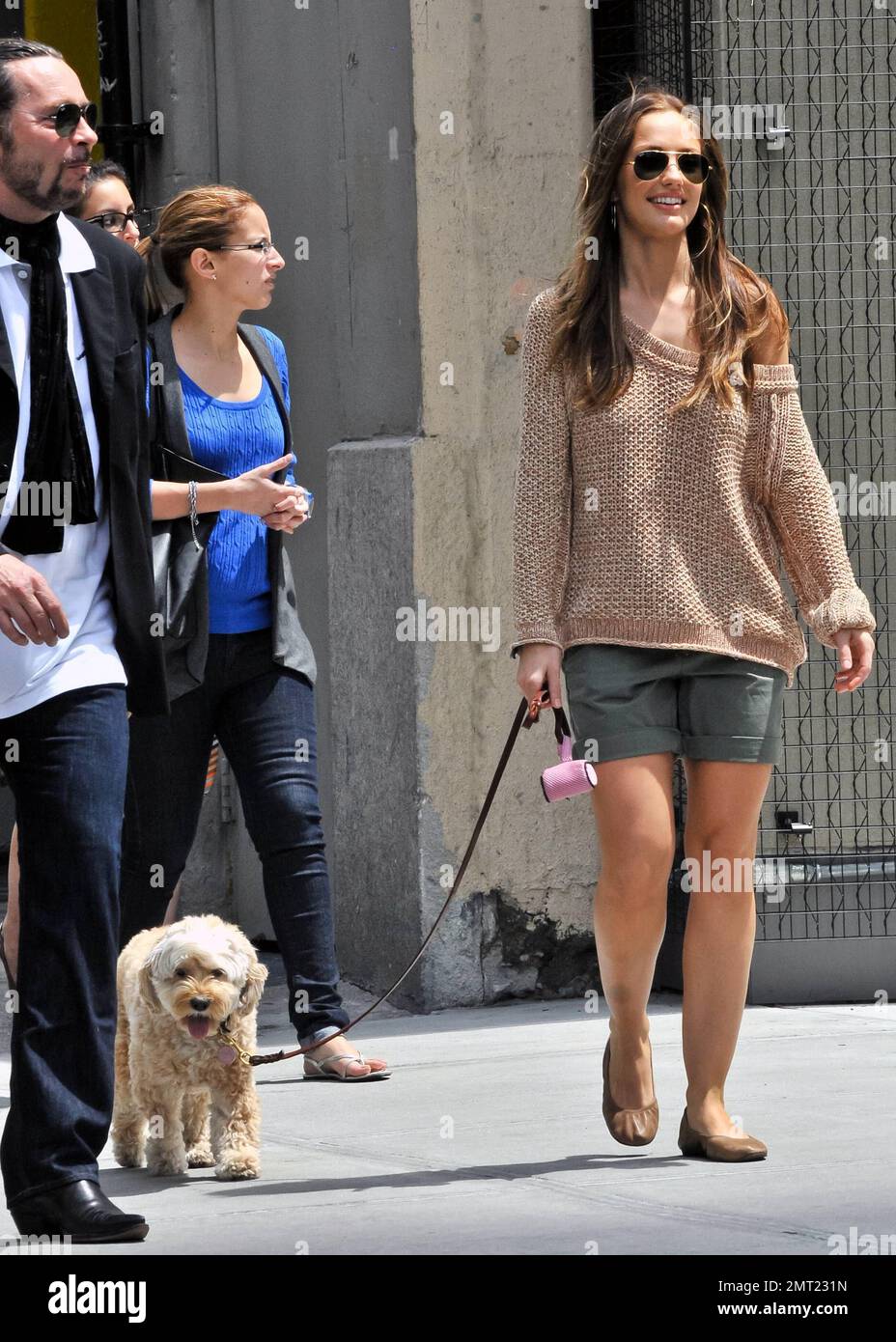 Minka Kelly looks to be in high spirits as she walks her dog and chats ...