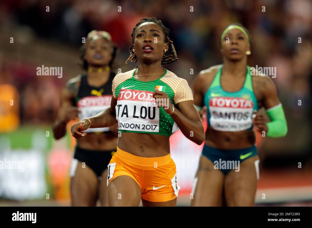Silver medalist Ivory Coast's Marie-Josee Ta Lou looks up at the score ...
