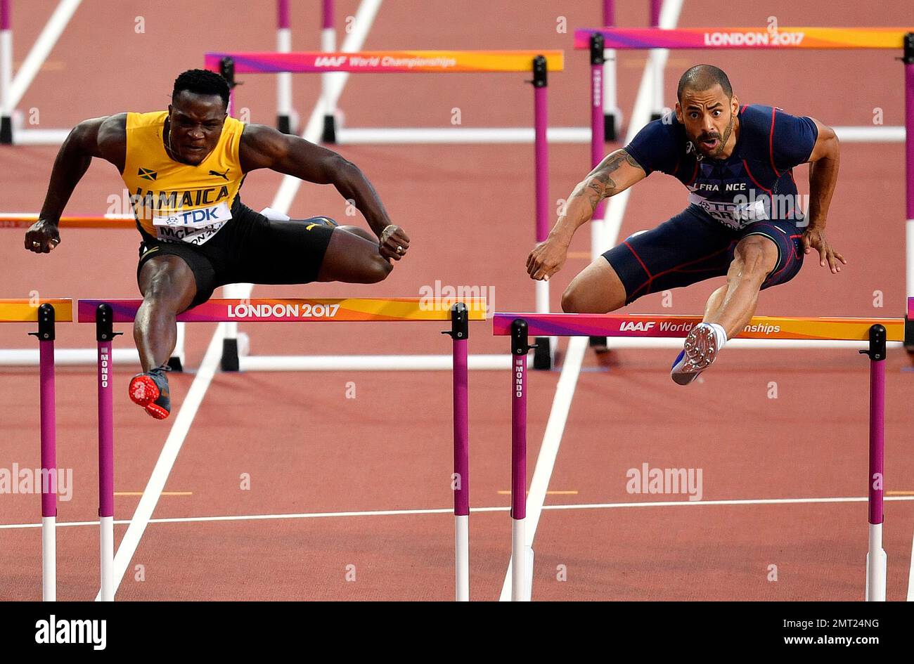 Jamaica's Omar Mcleod, left, leads France's Garfield Darien in their ...