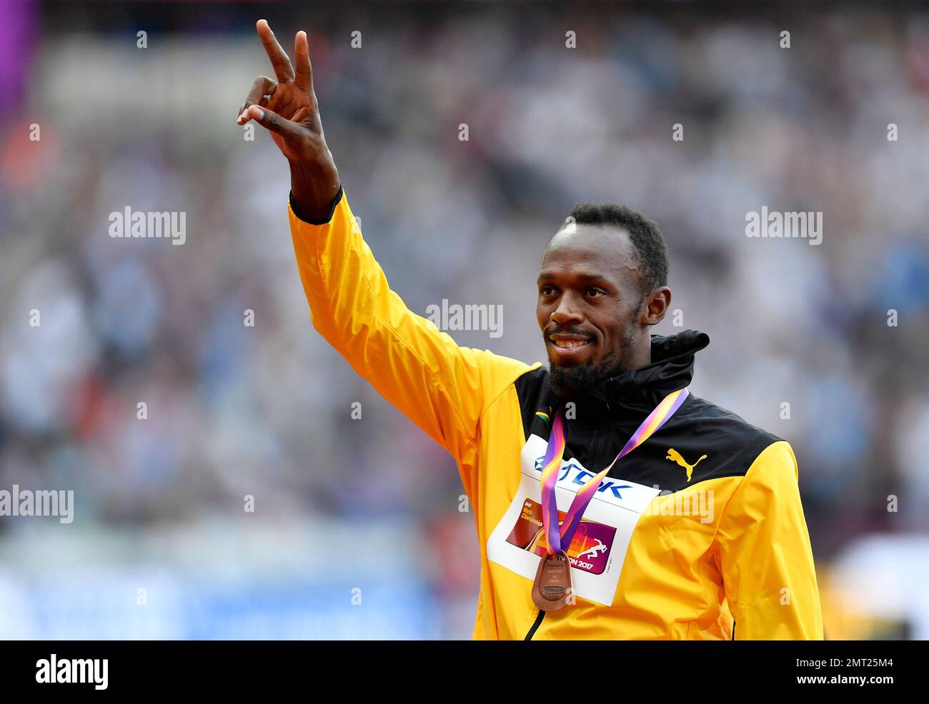 Bronze medalist Jamaica's Usain Bolt waves from the podium following ...