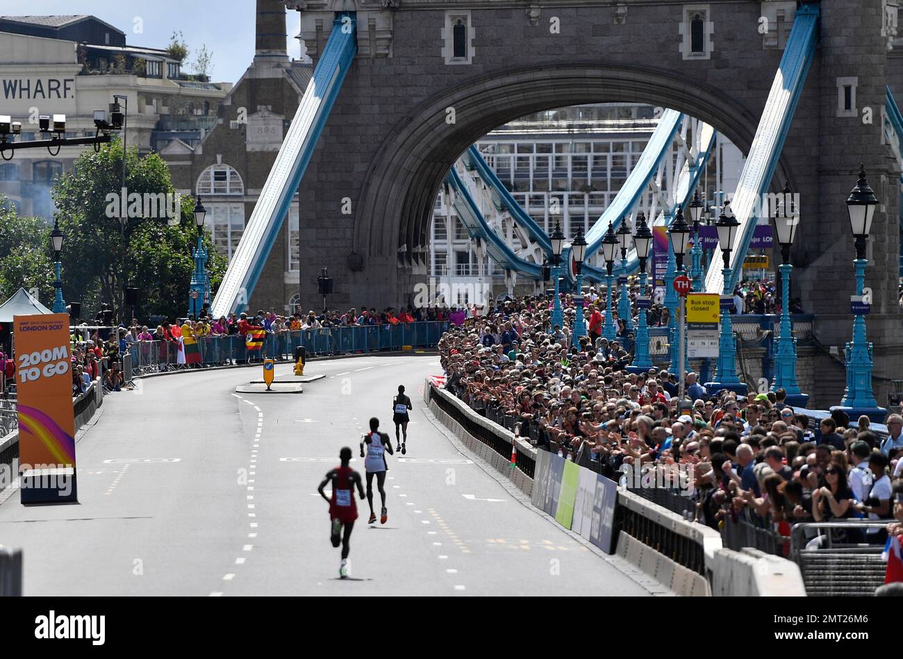 Crowds line the route as runners approach the finish of the Men's ...