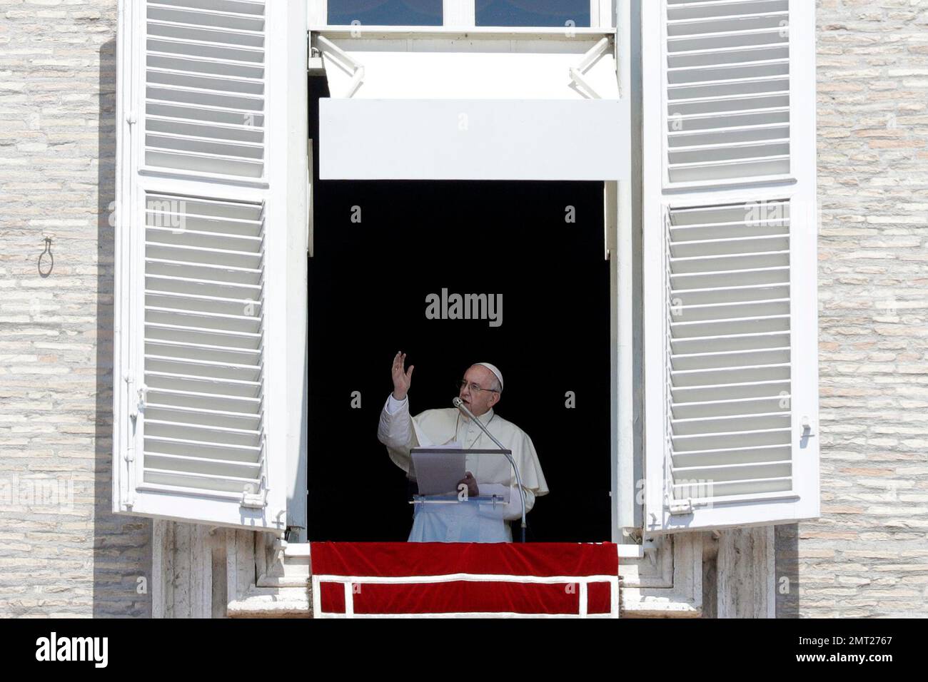 Pope Francis delivers a blessing from his studio window overlooking St ...