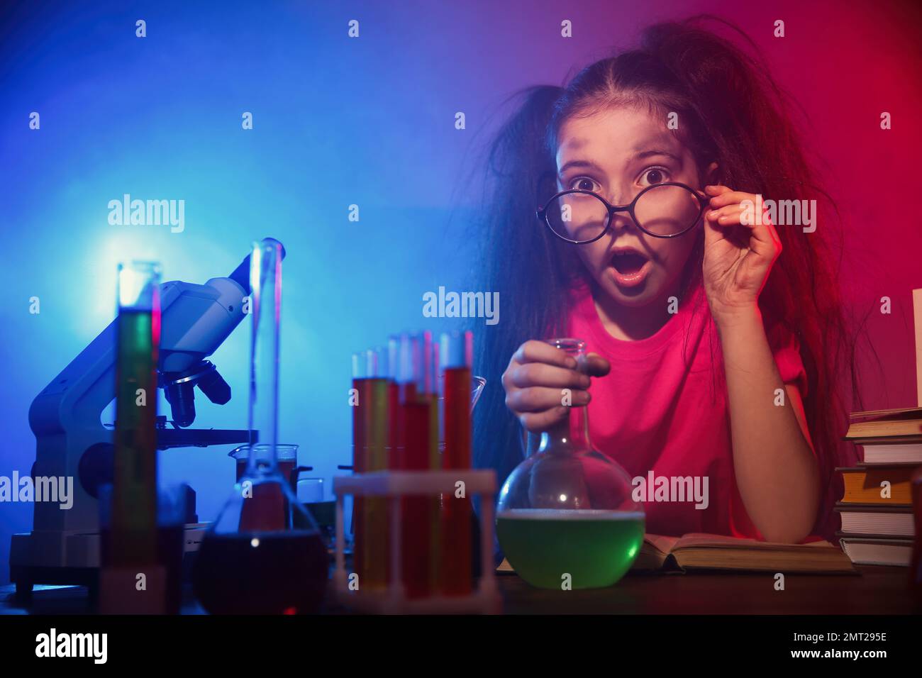Child doing chemical research in laboratory. Dangerous experiment Stock ...