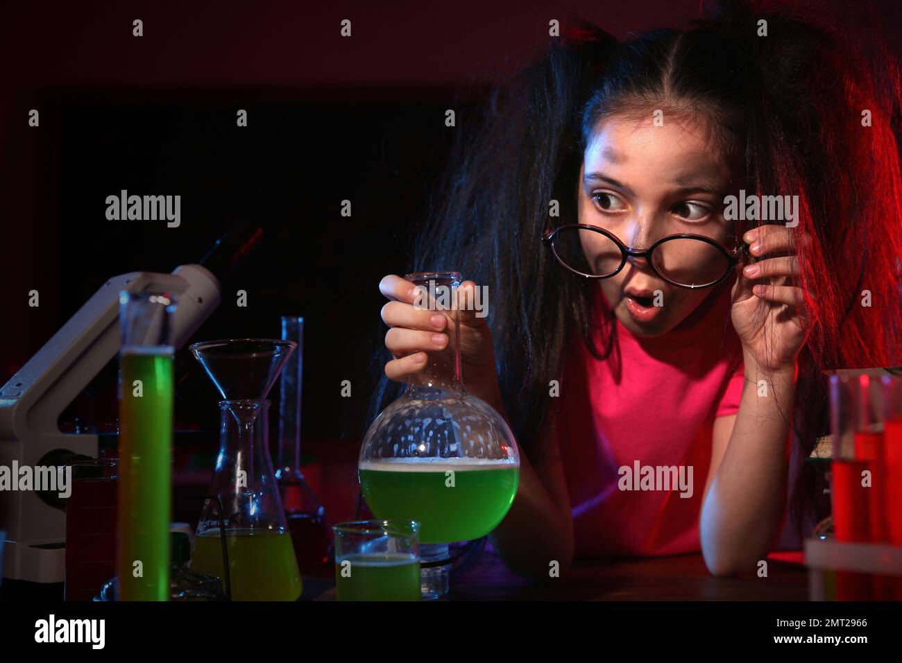 Child doing chemical research in laboratory. Dangerous experiment Stock ...