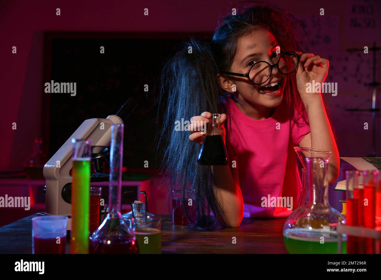 Child doing chemical research in laboratory. Dangerous experiment Stock ...