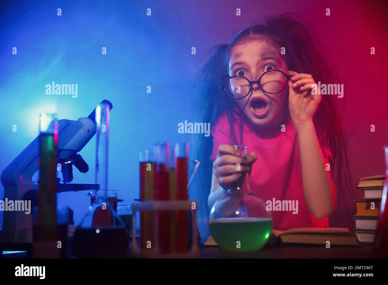 Child doing chemical research in laboratory. Dangerous experiment Stock ...