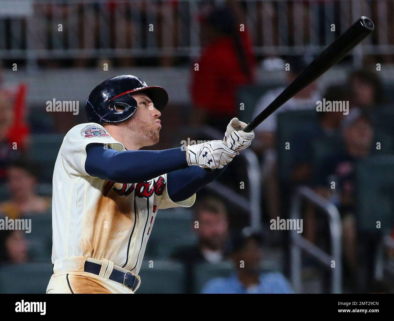 Atlanta Braves first baseman Freddie Freeman follows through on a three ...