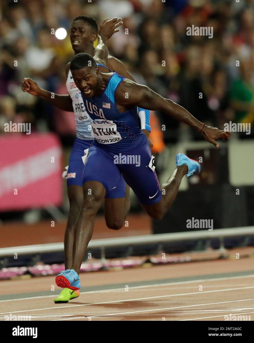 United States' Justin Gatlin crosses the line to win the gold medal in ...