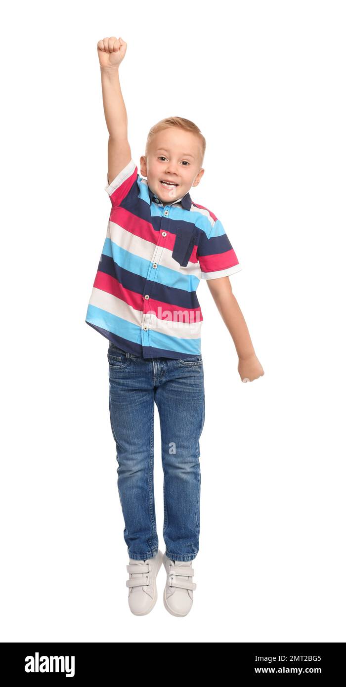 Cute little boy jumping on white background Stock Photo - Alamy