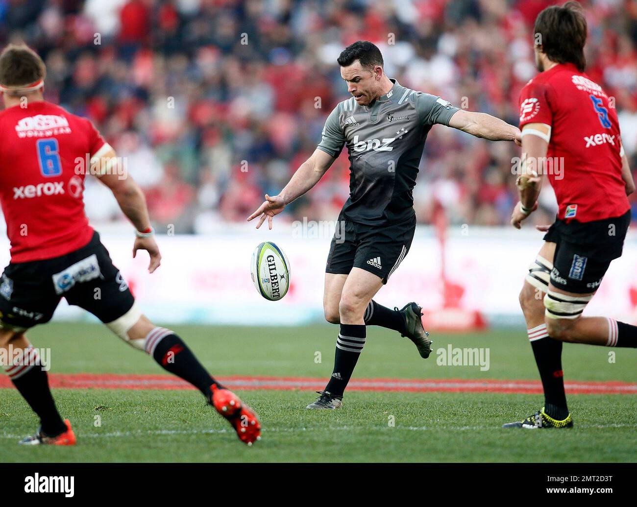 Crusaders Ryan Crotty kicks the ball during the Super Rugby final ...