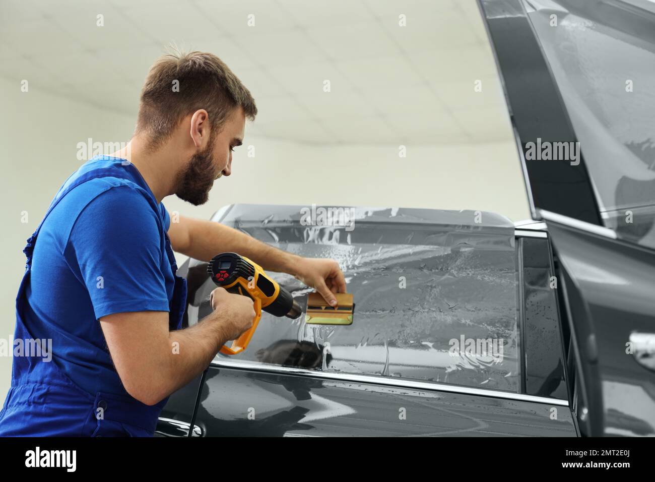 Heat gun window tinting hi-res stock photography and images - Alamy