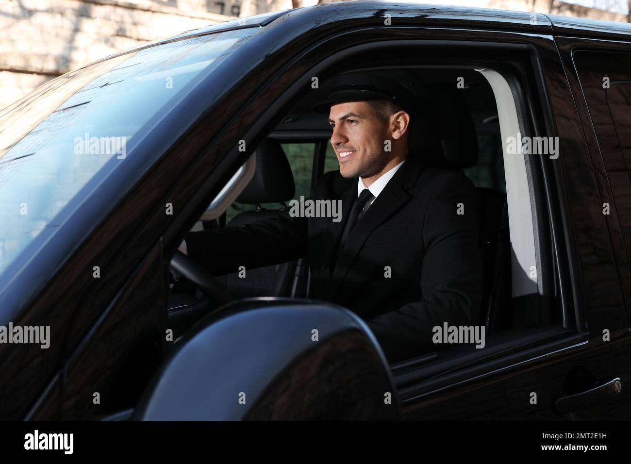 Professional driver in luxury car. Chauffeur service Stock Photo - Alamy