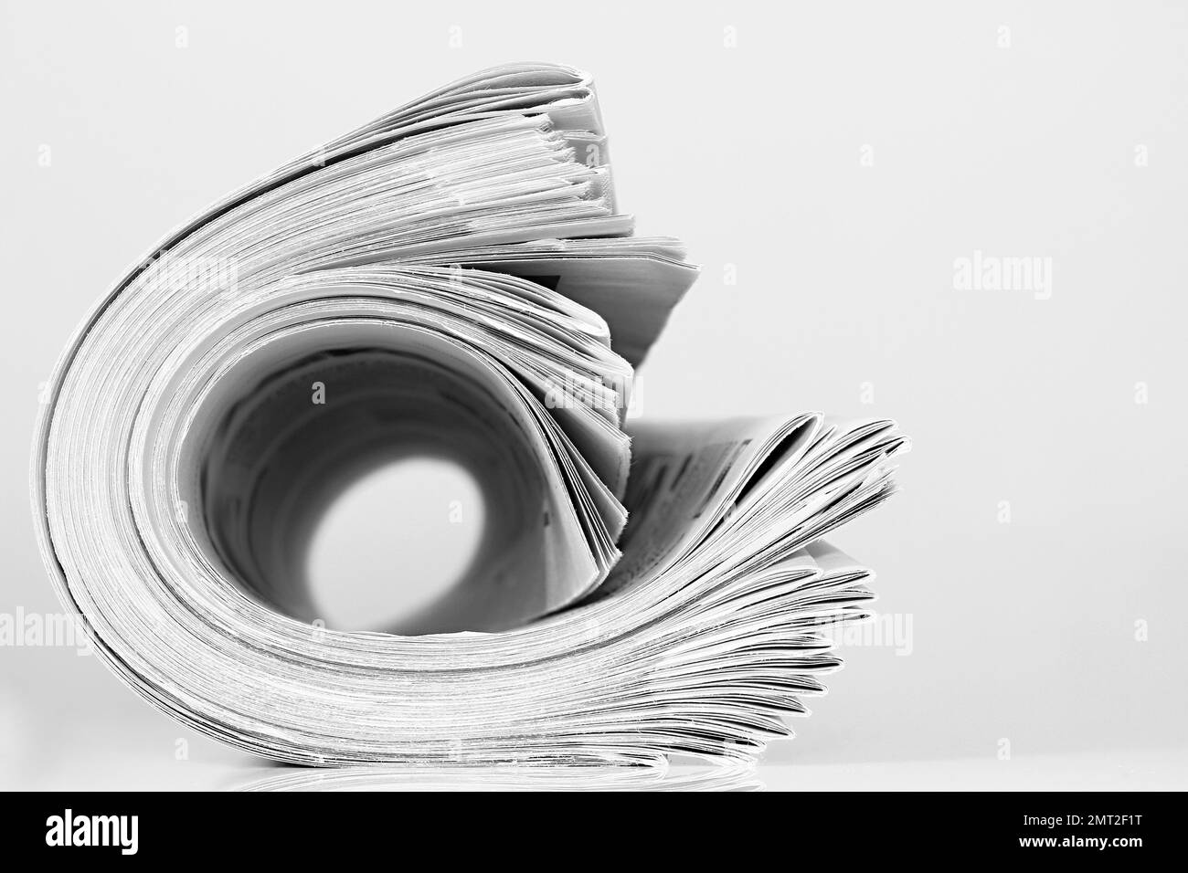 A greyscale of stack of newspapers isolated on a white background Stock ...