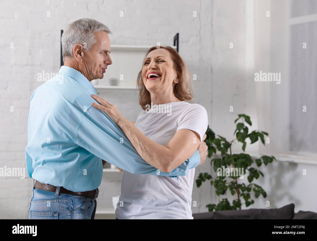 Excited couple dancing together having hi-res stock photography and ...