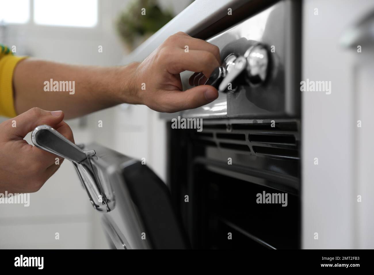 Person using gas cooker hi-res stock photography and images - Alamy