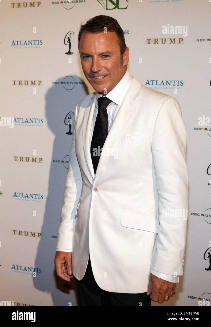 Colin Cowie, a judge for the Miss Universe pageant, poses on the red ...