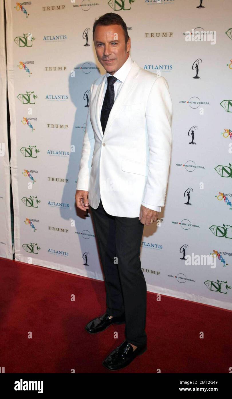 - Colin Cowie, a judge for the Miss Universe pageant, poses on the red ...