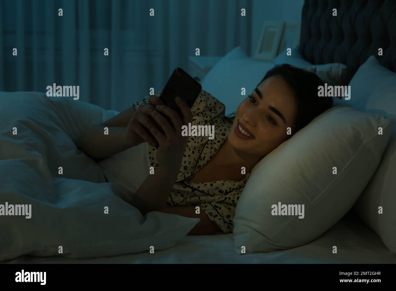 Woman cellphone night in room hi-res stock photography and images - Alamy