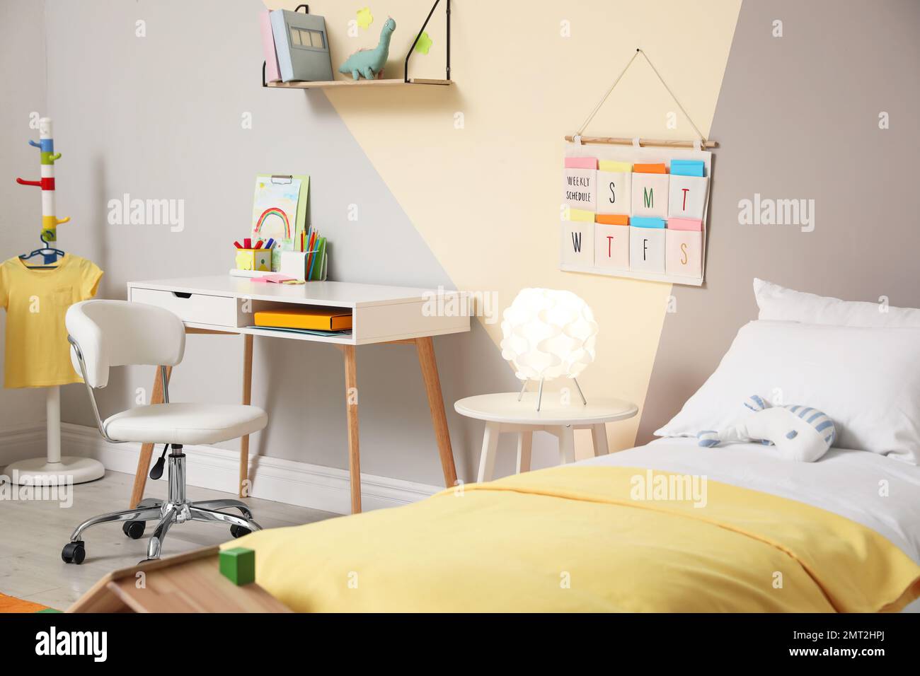 Stylish child room interior with comfortable bed and desk Stock Photo ...