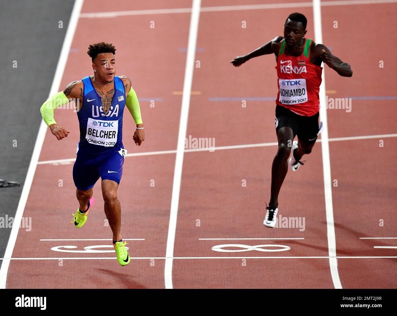 United States' Christopher Belcher, left, crosses the finish line in ...