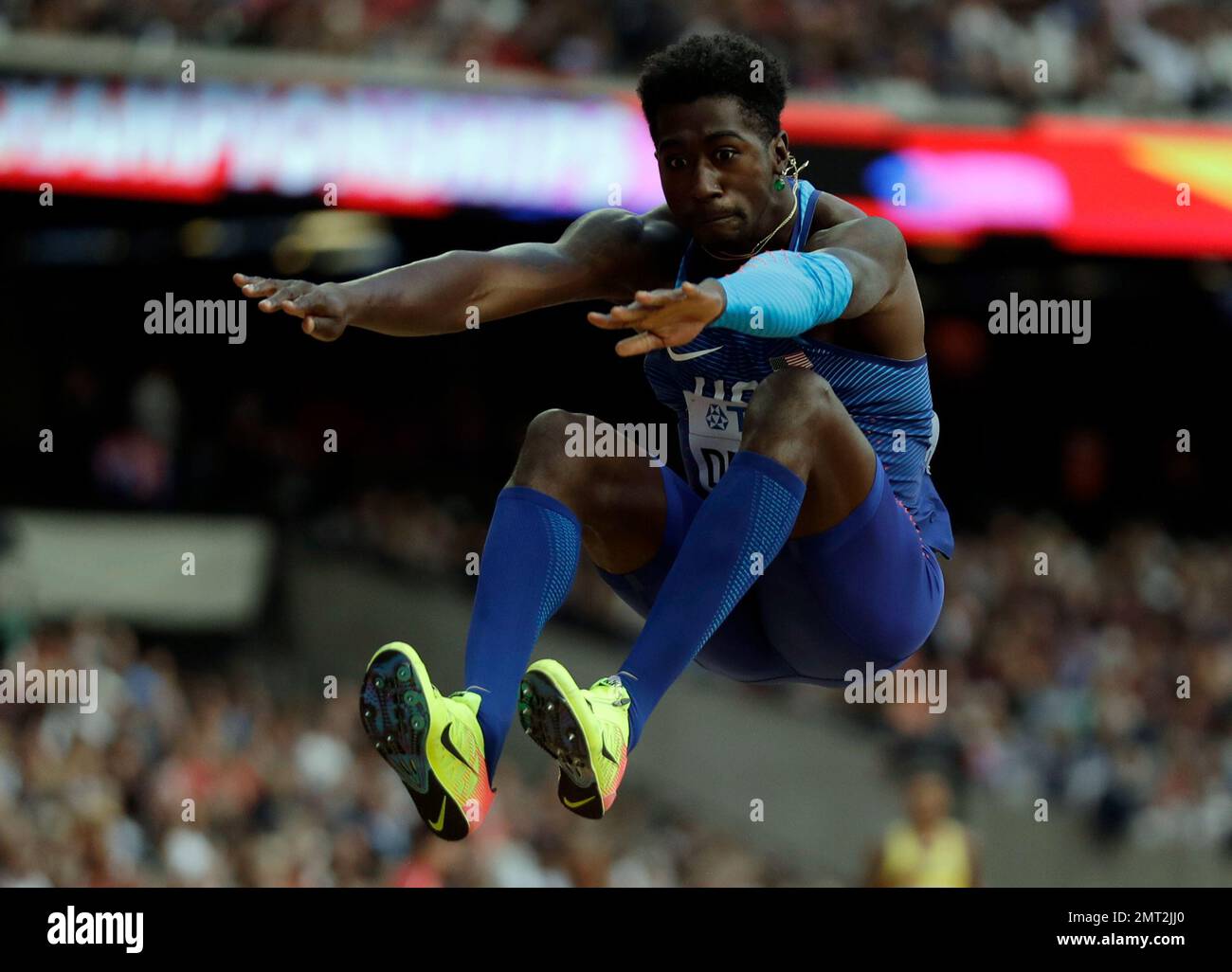 United States' Marquis Dendy competes in men's long jump qualification ...
