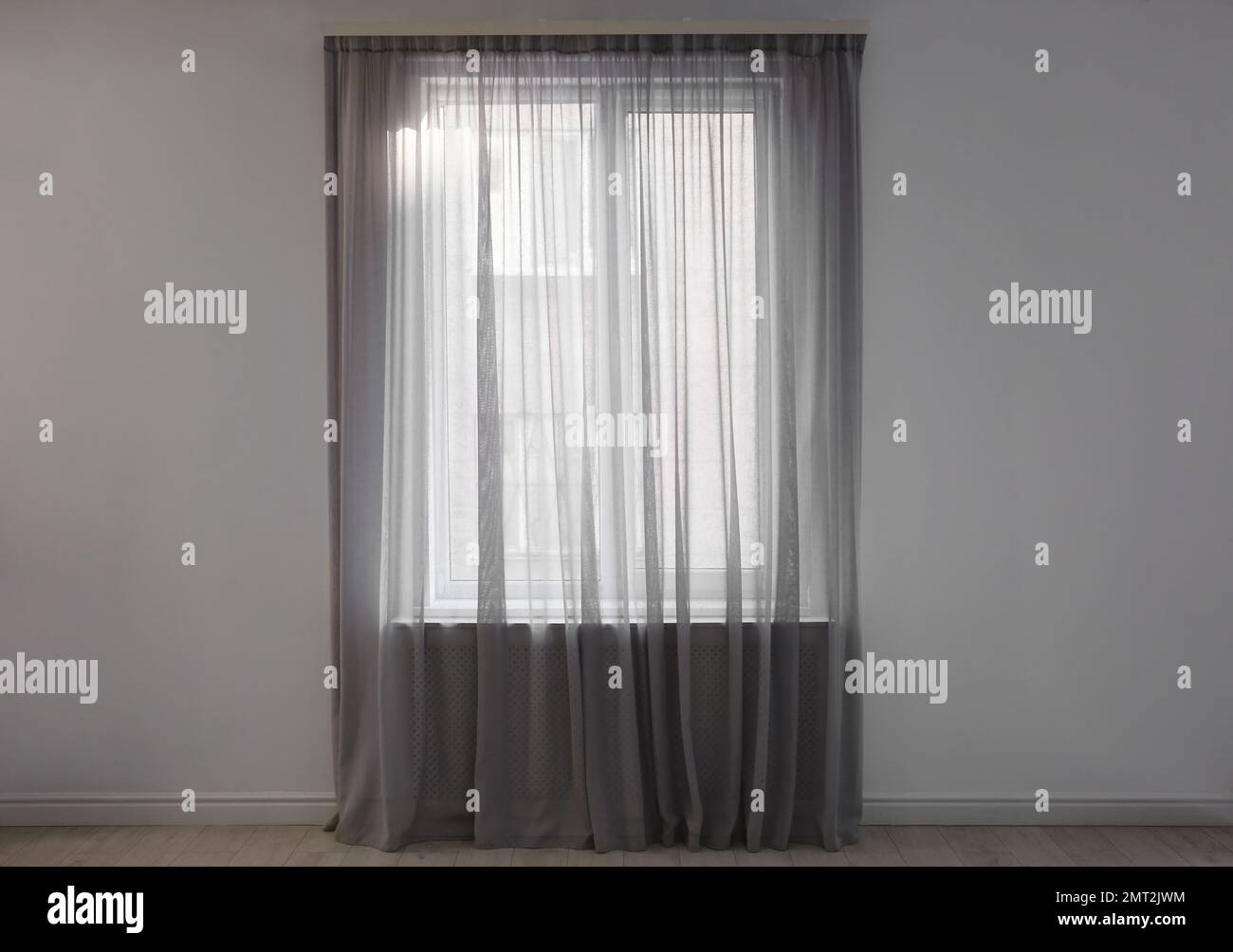 Window with beautiful curtains in empty room Stock Photo - Alamy