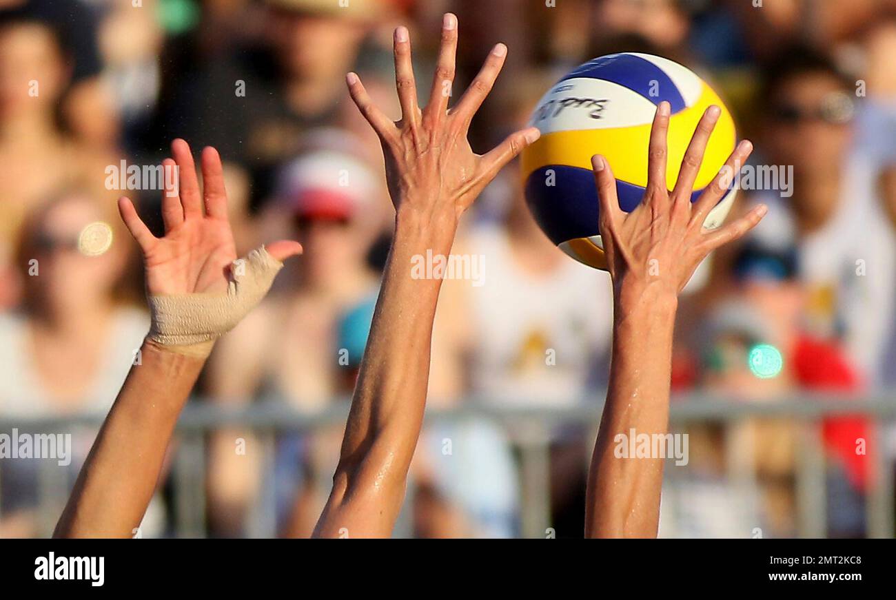 United States's Lauren Fendrick plays the ball to Canada's Sarah Pavan ...