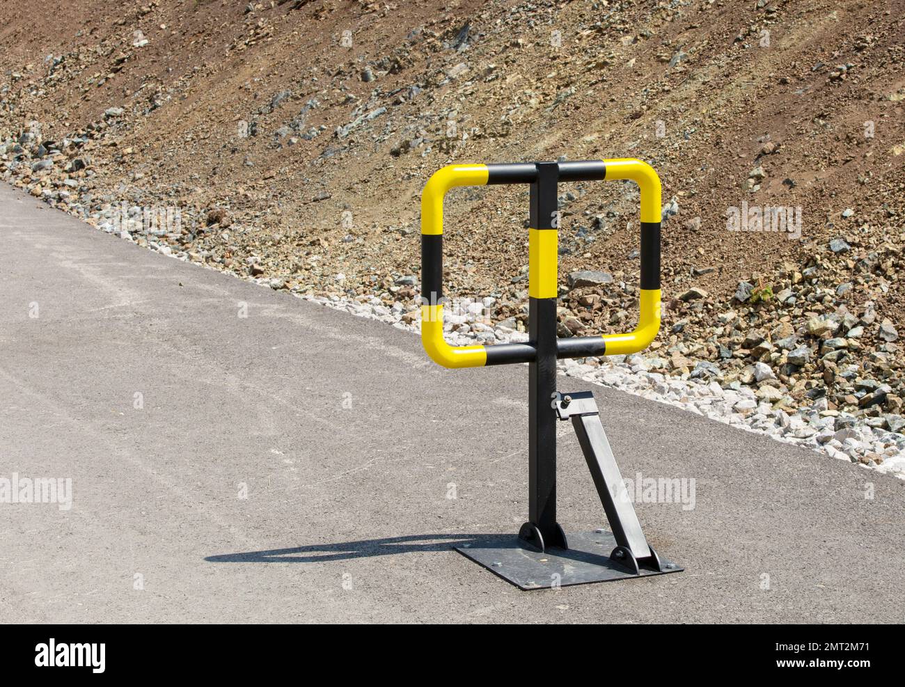 The yellow metal fencing prohibiting entry. Mechanical yellow barrier ...