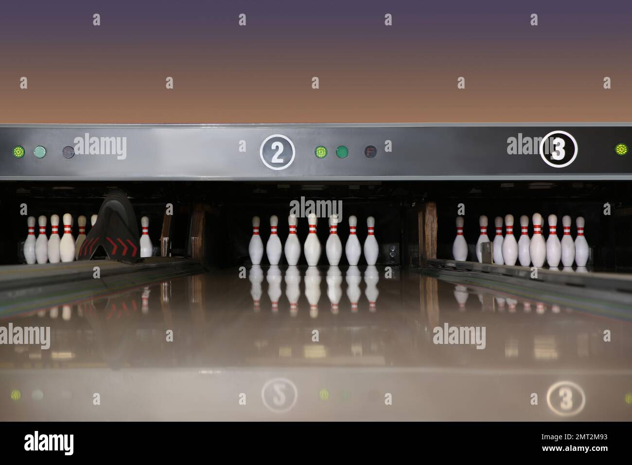 Bowling alley lanes with pins in club Stock Photo - Alamy
