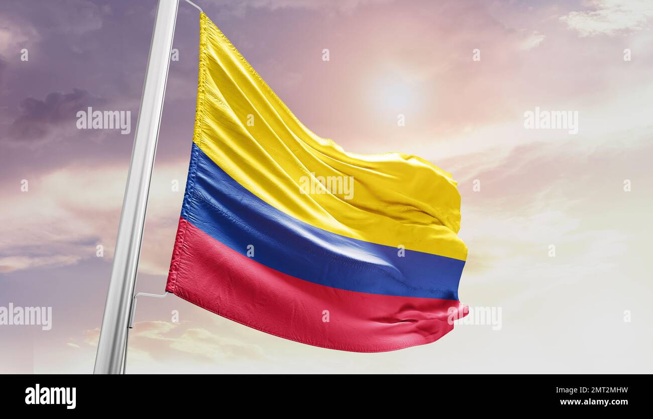 colombia waving flag in beautiful sky Stock Photo - Alamy