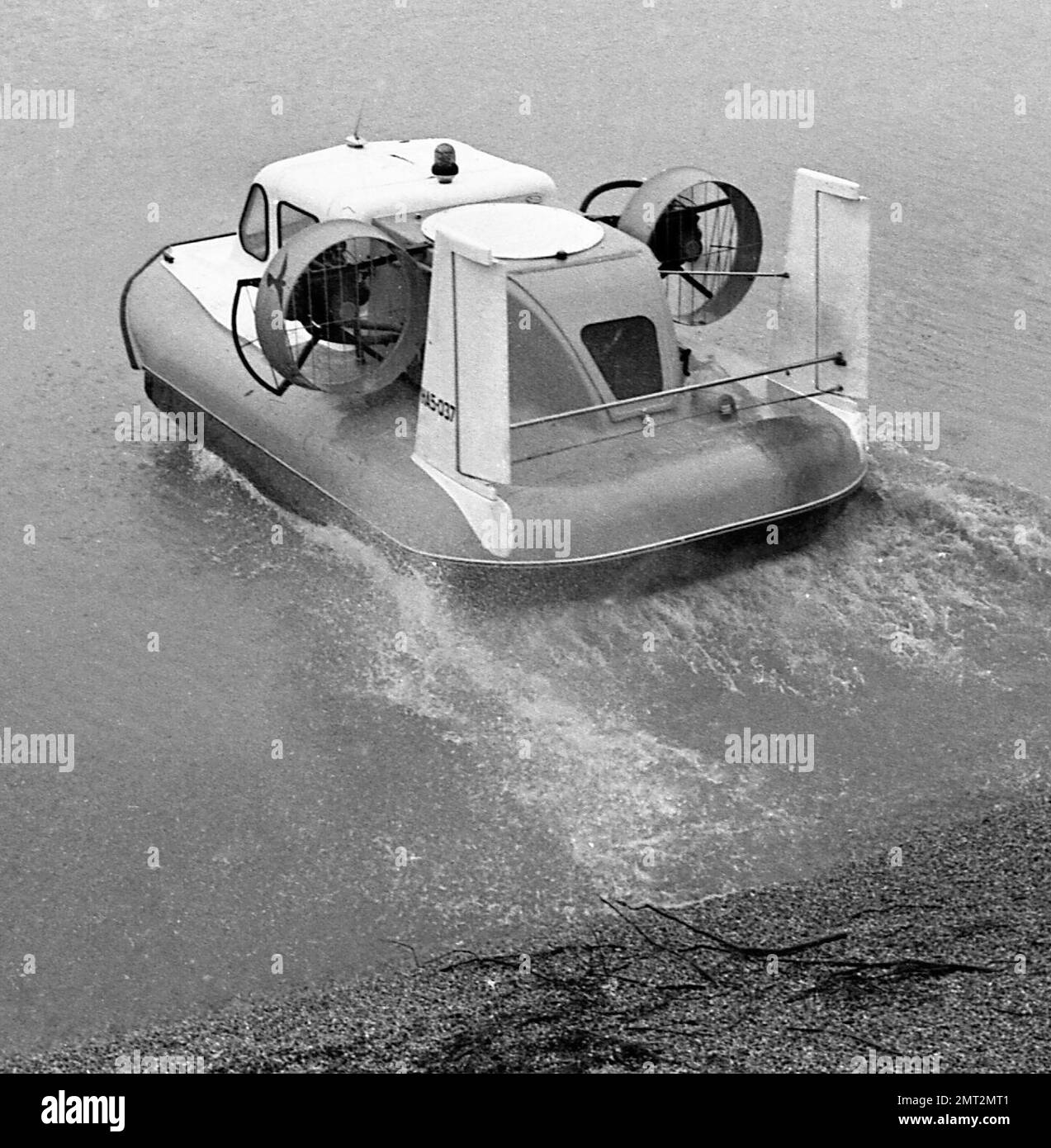 A view of a HA5 Hoverhawk Hovercraft taking to the water at Crowland ...