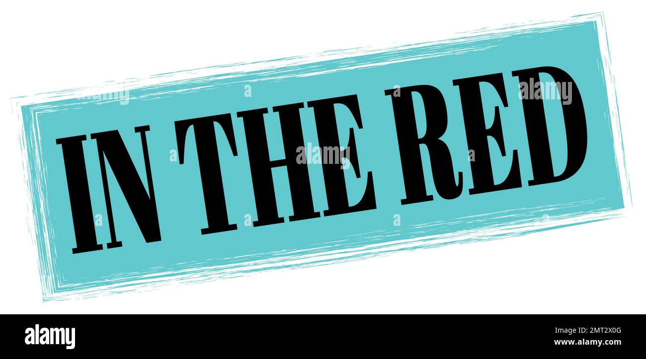 IN THE RED text written on blue-black rectangle stamp sign Stock Photo ...
