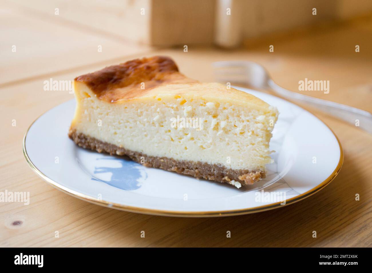 New York Cheesecake with cookie base Stock Photo - Alamy
