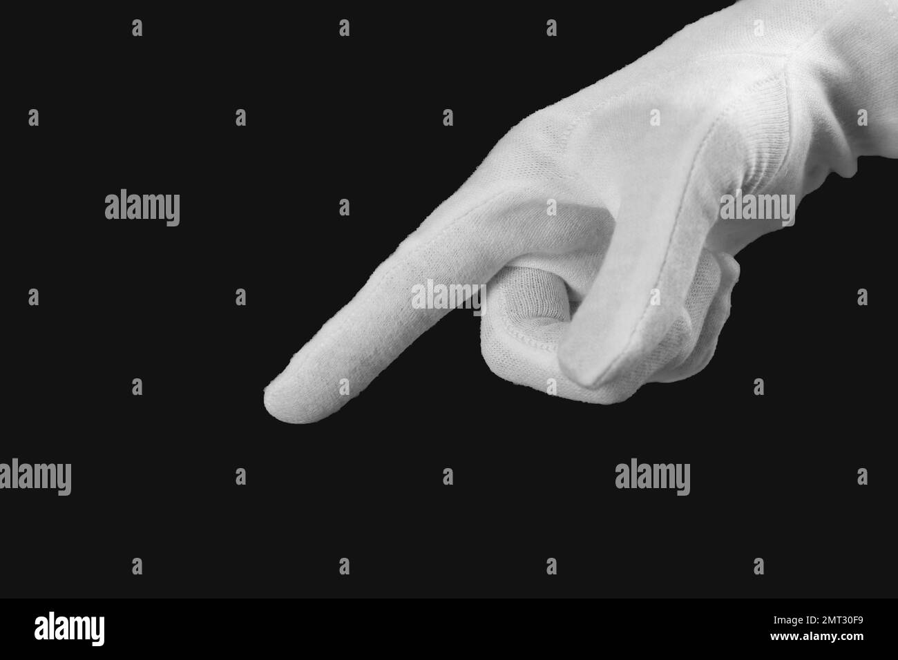 Person in white glove checking cleanliness of black background, closeup ...