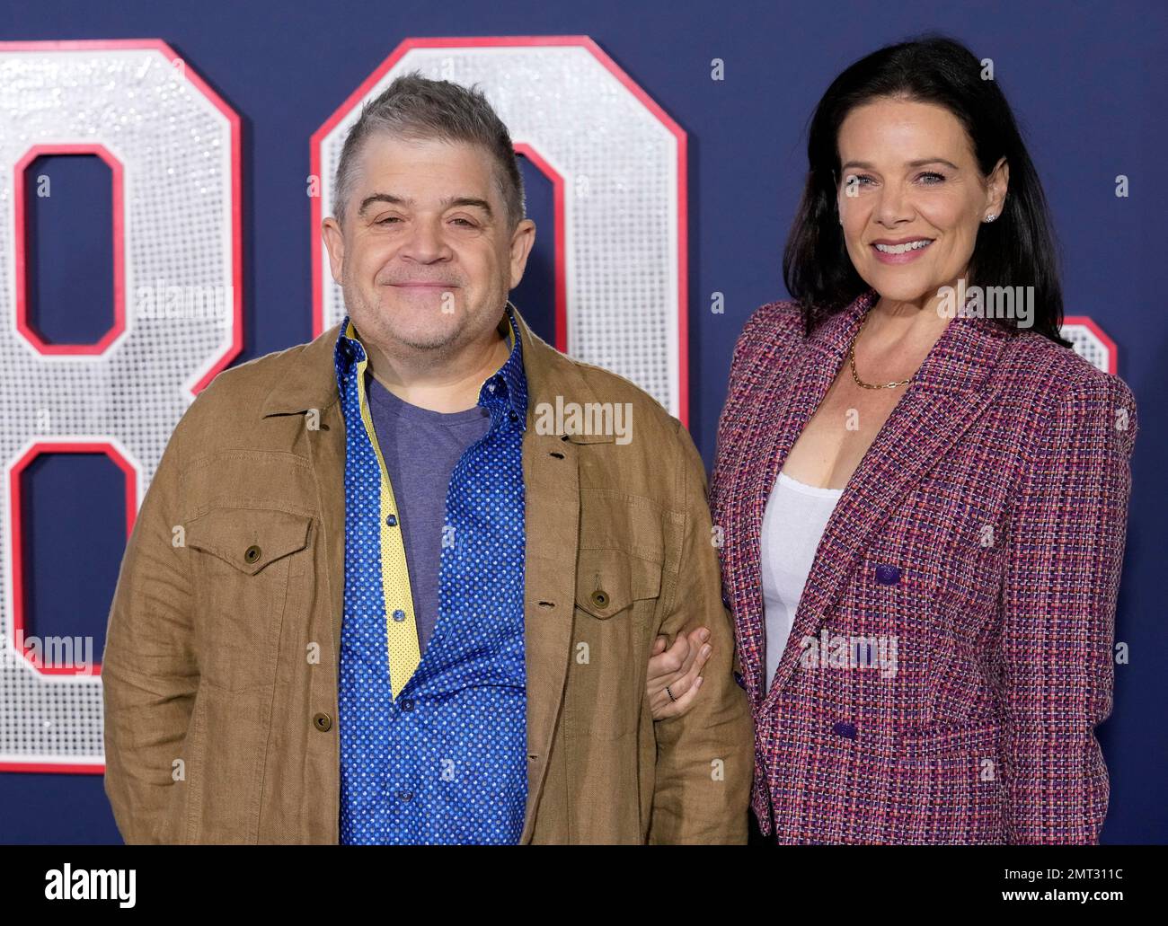 Patton Oswald and Meredith Salenger pose together at the premiere of ...
