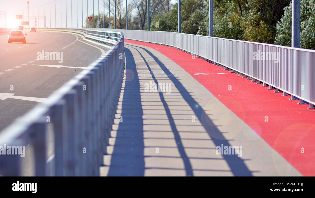 Bicycle path and sidewalk through the highway bridge Stock Photo - Alamy