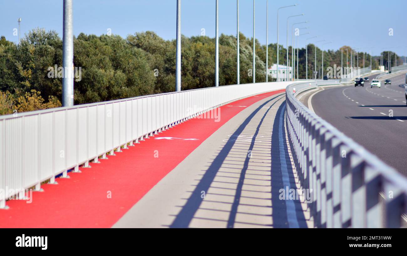 Bicycle path and sidewalk through the highway bridge Stock Photo - Alamy