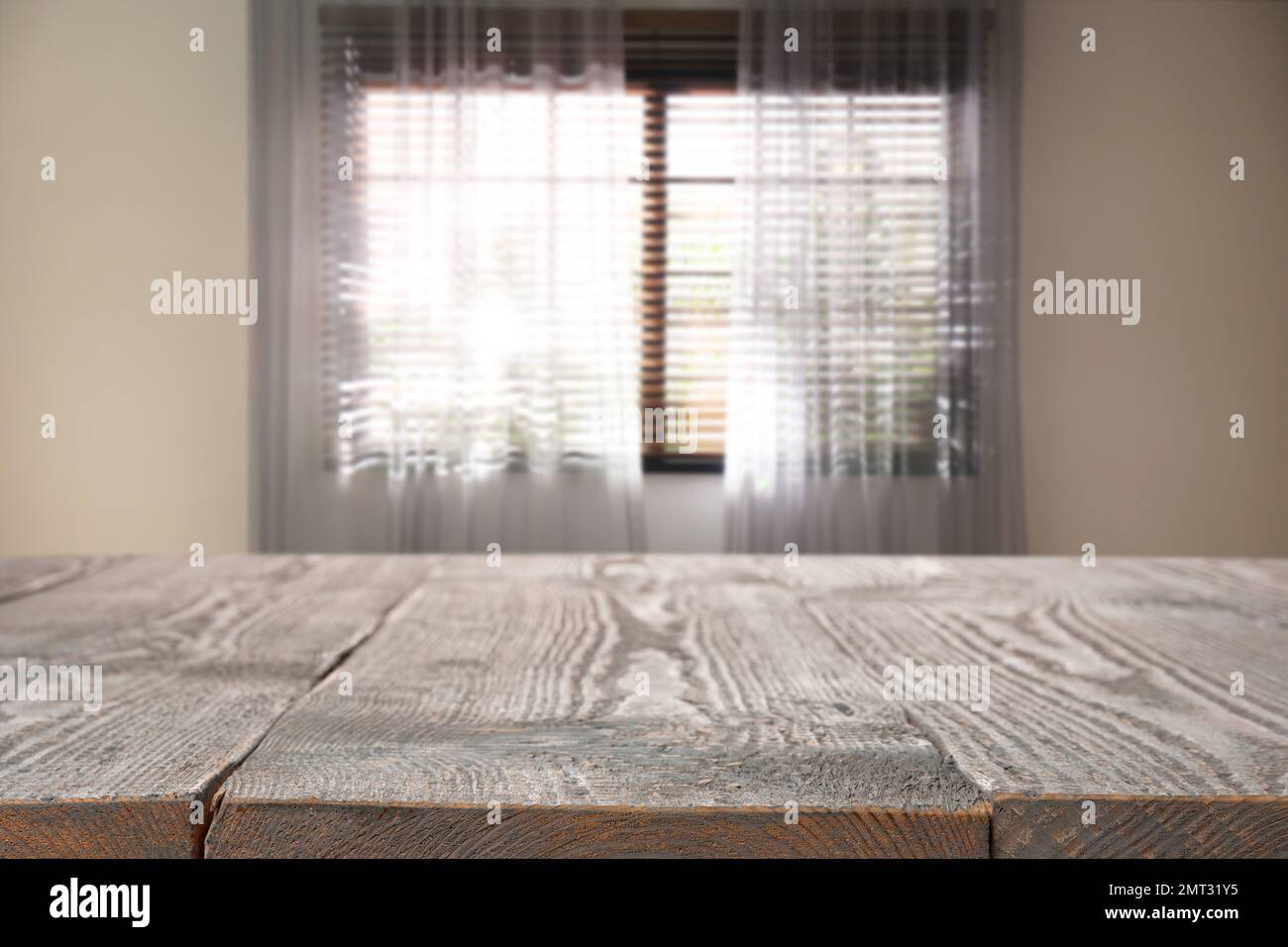 Empty wooden table in room. Space for design Stock Photo - Alamy