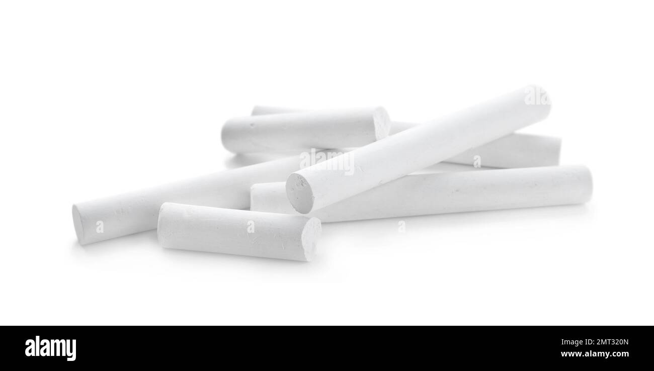 Small pieces of chalk on white background Stock Photo - Alamy
