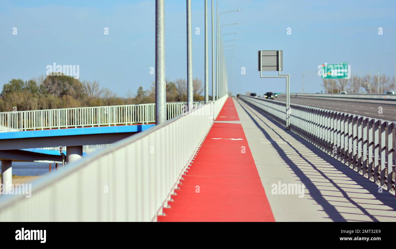 Bicycle path and sidewalk through the highway bridge Stock Photo - Alamy