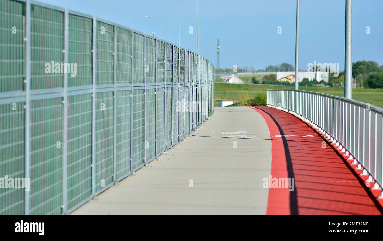 Bicycle path and sidewalk through the highway bridge Stock Photo - Alamy