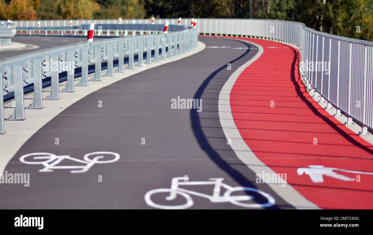 Bicycle path and sidewalk through the highway bridge Stock Photo - Alamy