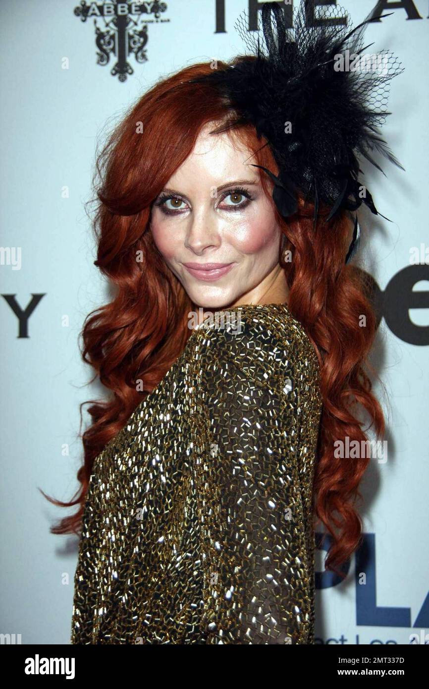 Phoebe Price poses on the red carpet of the APLA Oscar Viewing Party at ...