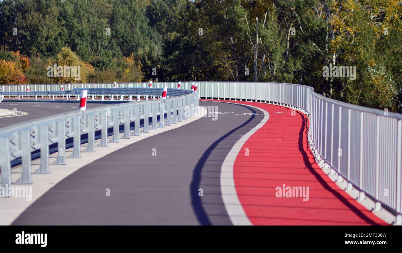 Bicycle path and sidewalk through the highway bridge Stock Photo - Alamy
