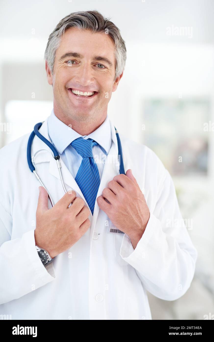 Hes a leader in the medical field. Portrait of a male doctor standing ...