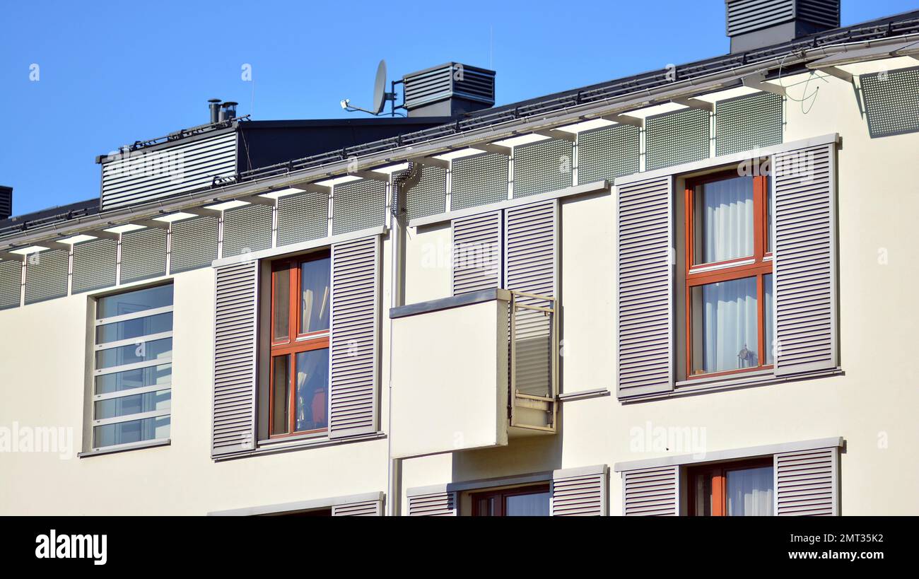 Modern apartment buildings on a sunny day with a blue sky. Facade of a ...